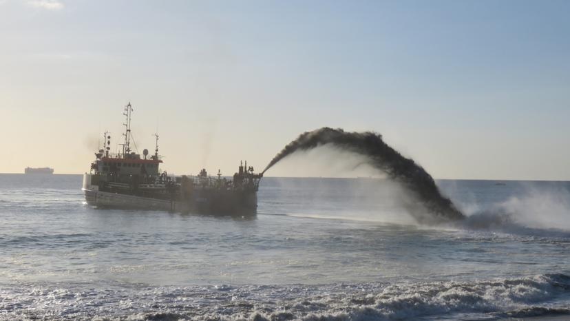 Rainbow effect of dredged ocean sand helping to rebuild Port Beach ...