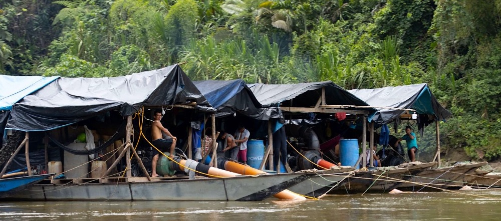 Illegal gold mining devastates Peruvian Amazon river and communities ...