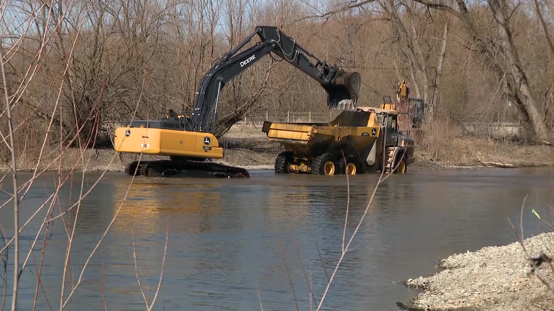 Workers dredge sediment in ponds along Logan River for better ...